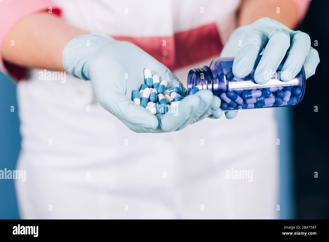 doctor holding medication Stock Photo - Alamy