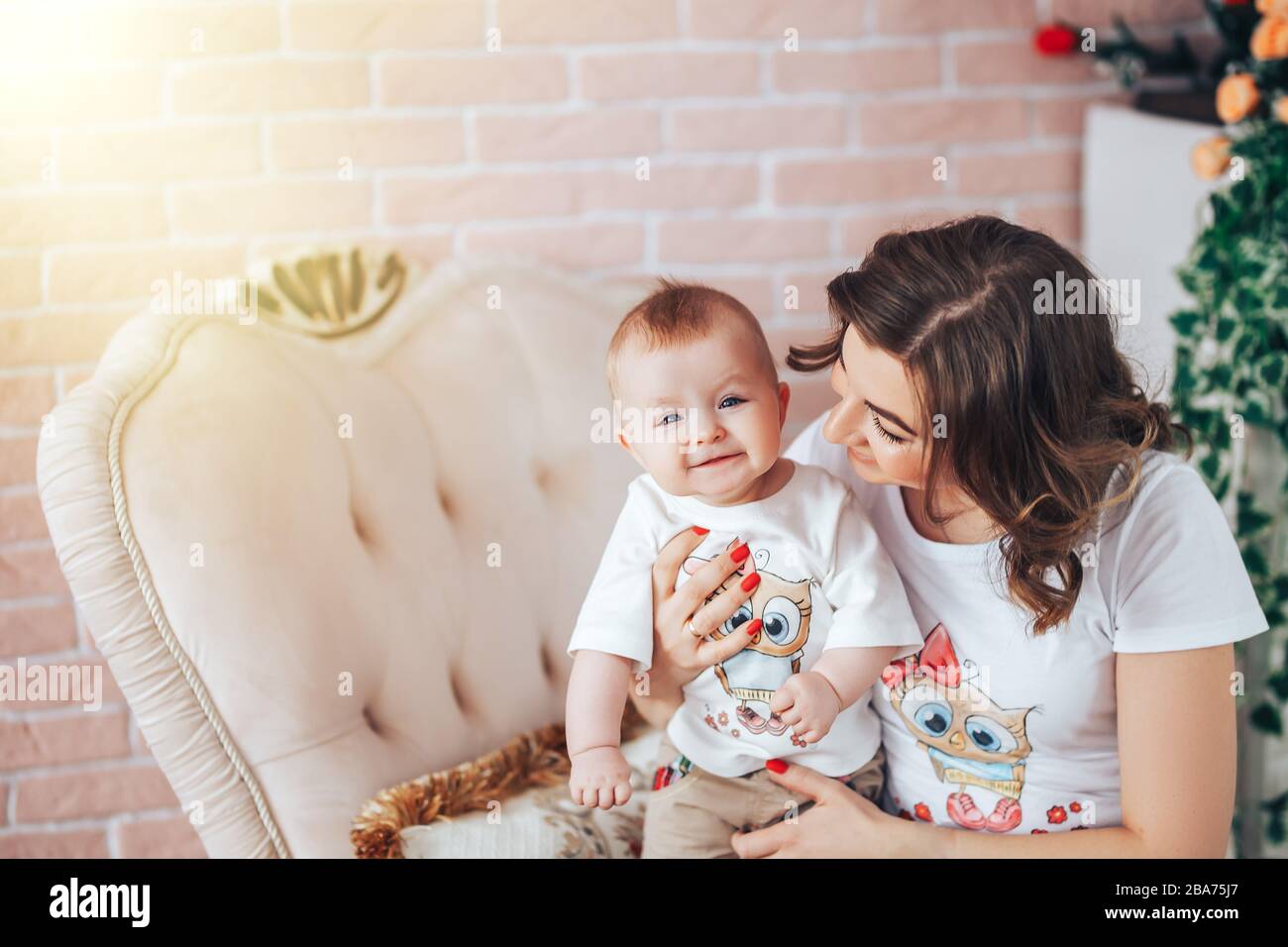 Mother's day. Young beautiful mother hugging with her little baby Stock Photo - Alamy
