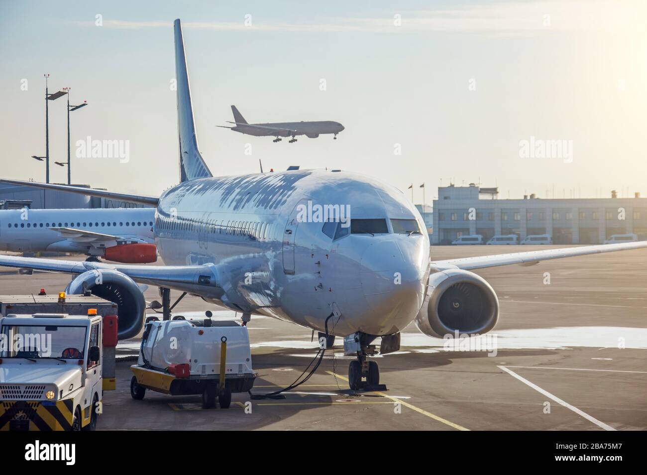 Passenger jet liner parked during the service before the flight. In the ...