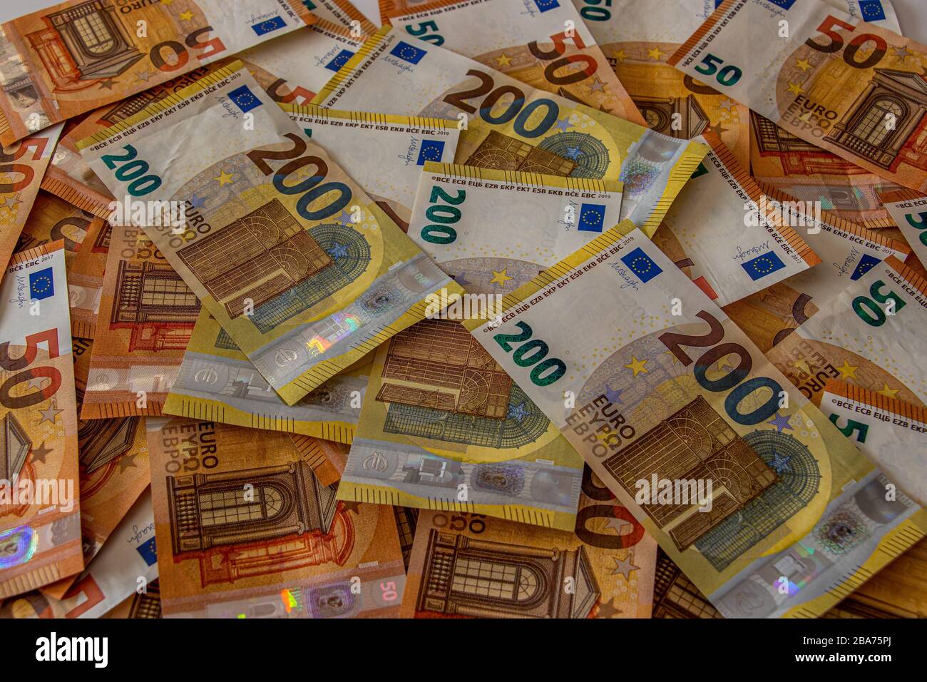 50, 200 euro notes on table Stock Photo - Alamy