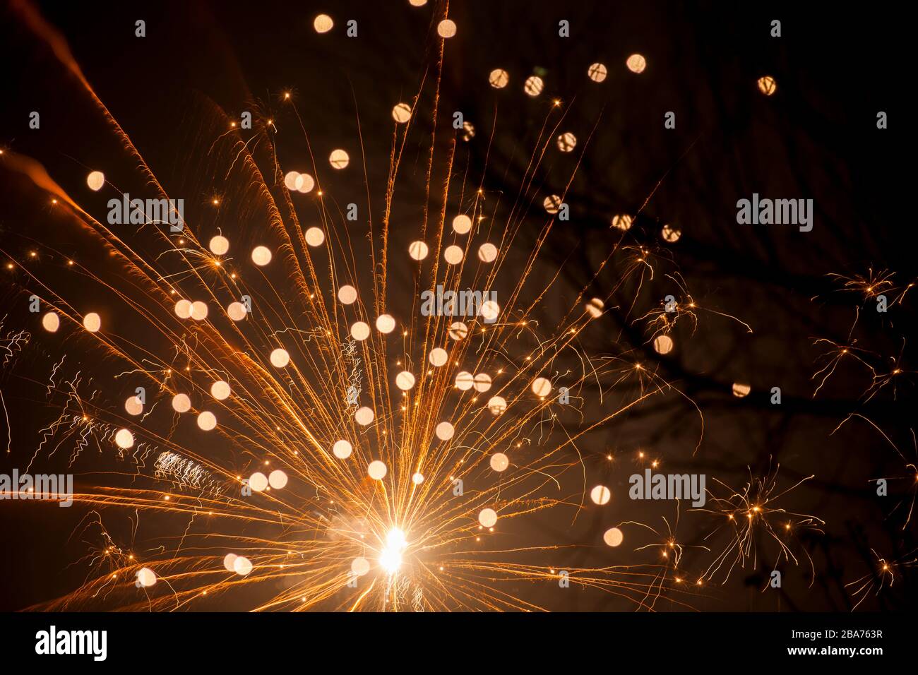 Colorful fireworks explode at night Stock Photo - Alamy