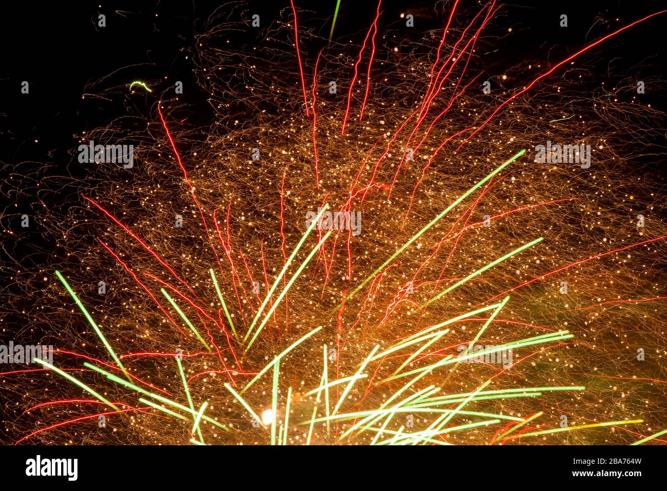 Colorful fireworks explode at night Stock Photo - Alamy
