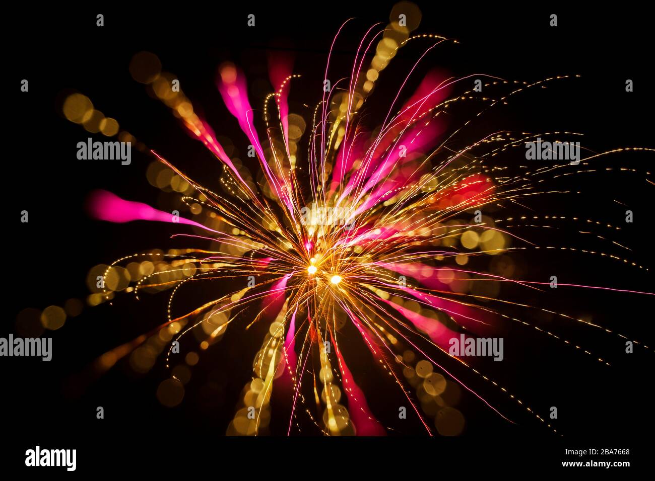 Colorful fireworks explode at night Stock Photo - Alamy