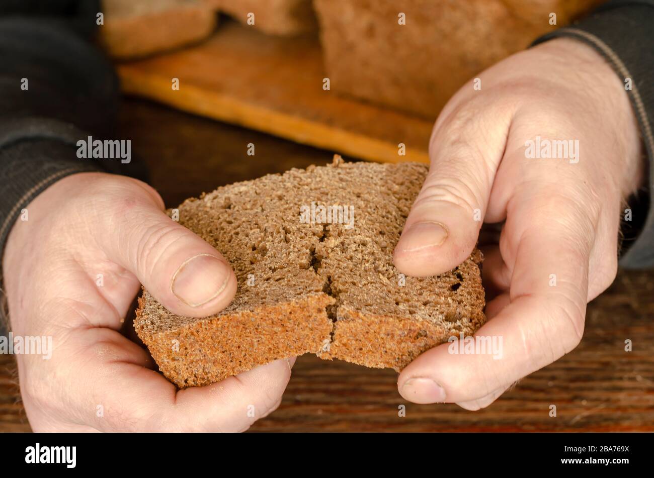 Holding A Loaf Of Bread In His Hands High Resolution Stock Photography ...
