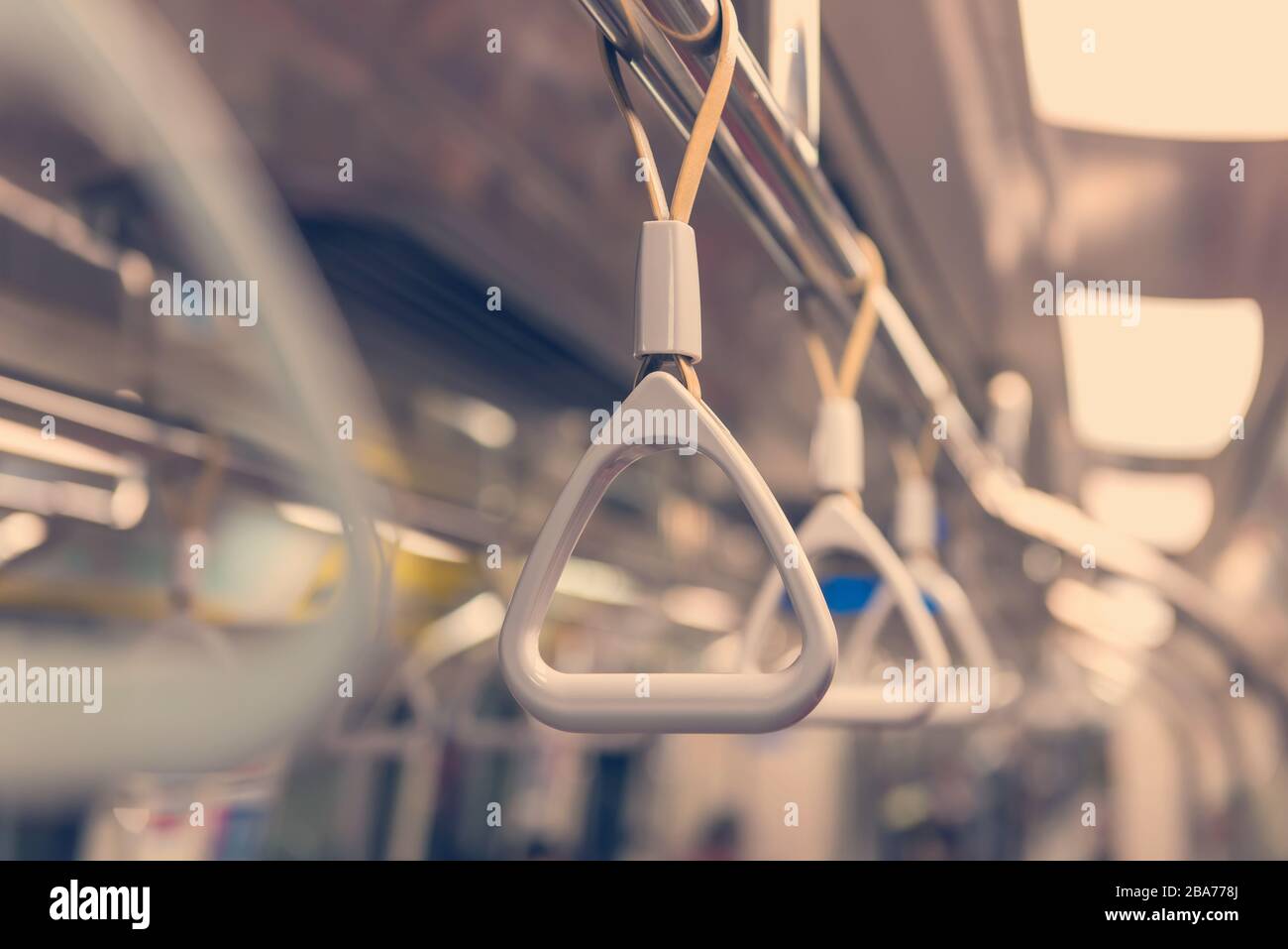 Handles standing passenger inside bus transportation hi-res stock ...