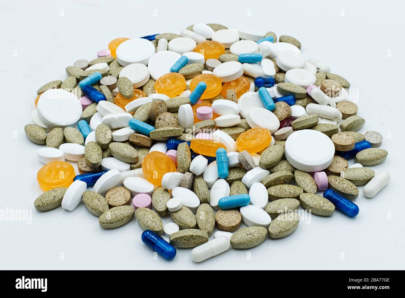 A lot of colored pharmaceutical pills inside a supermarket trolley ...