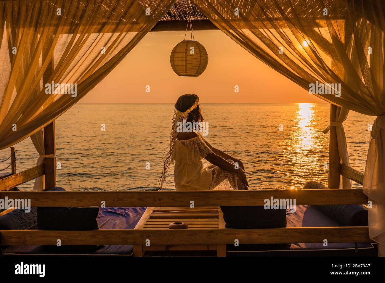 Turkey, Fethiye sunset by the beach trough a window with a view at the ...