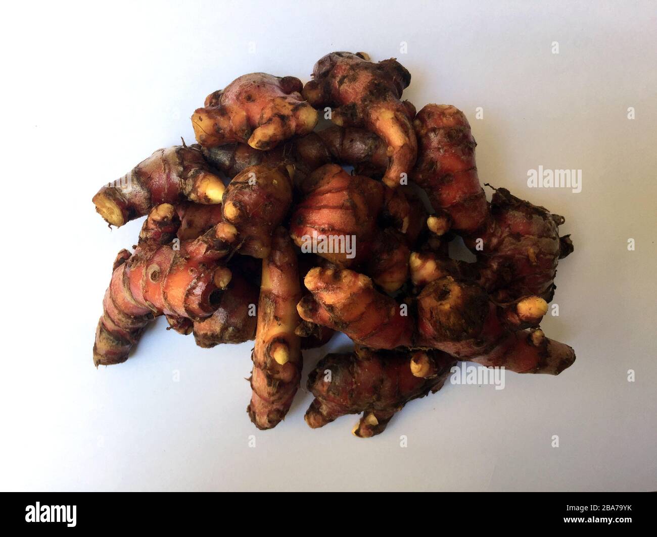 Red Ginger or Jahe Merah isolated on white background Stock Photo - Alamy