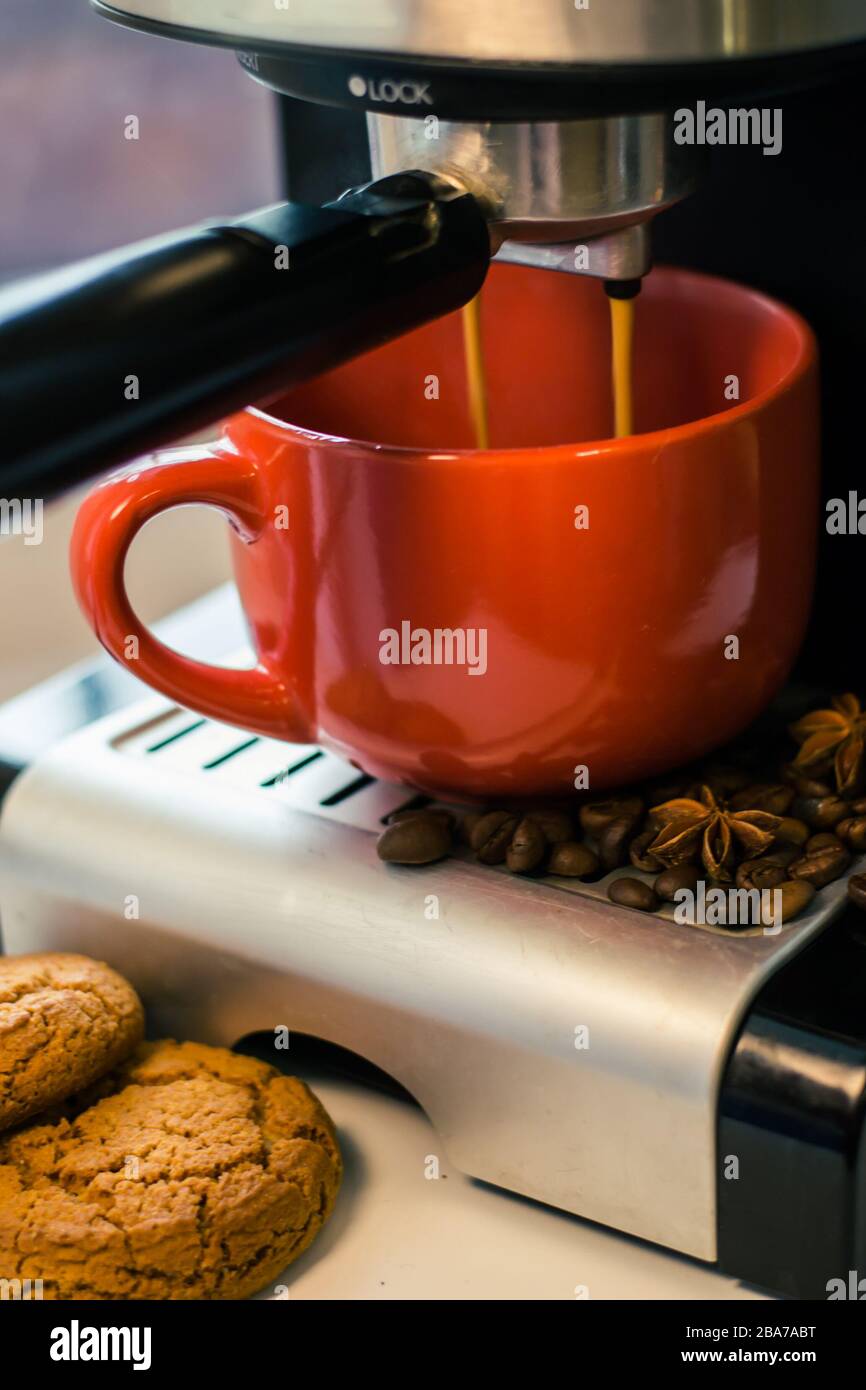 Make fresh coffee in a coffee machine with flavoring Stock Photo - Alamy