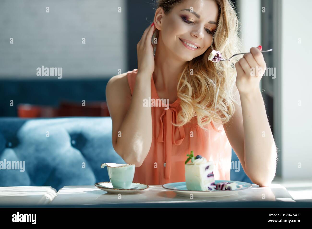Girl has breakfast in a cafe Stock Photo - Alamy