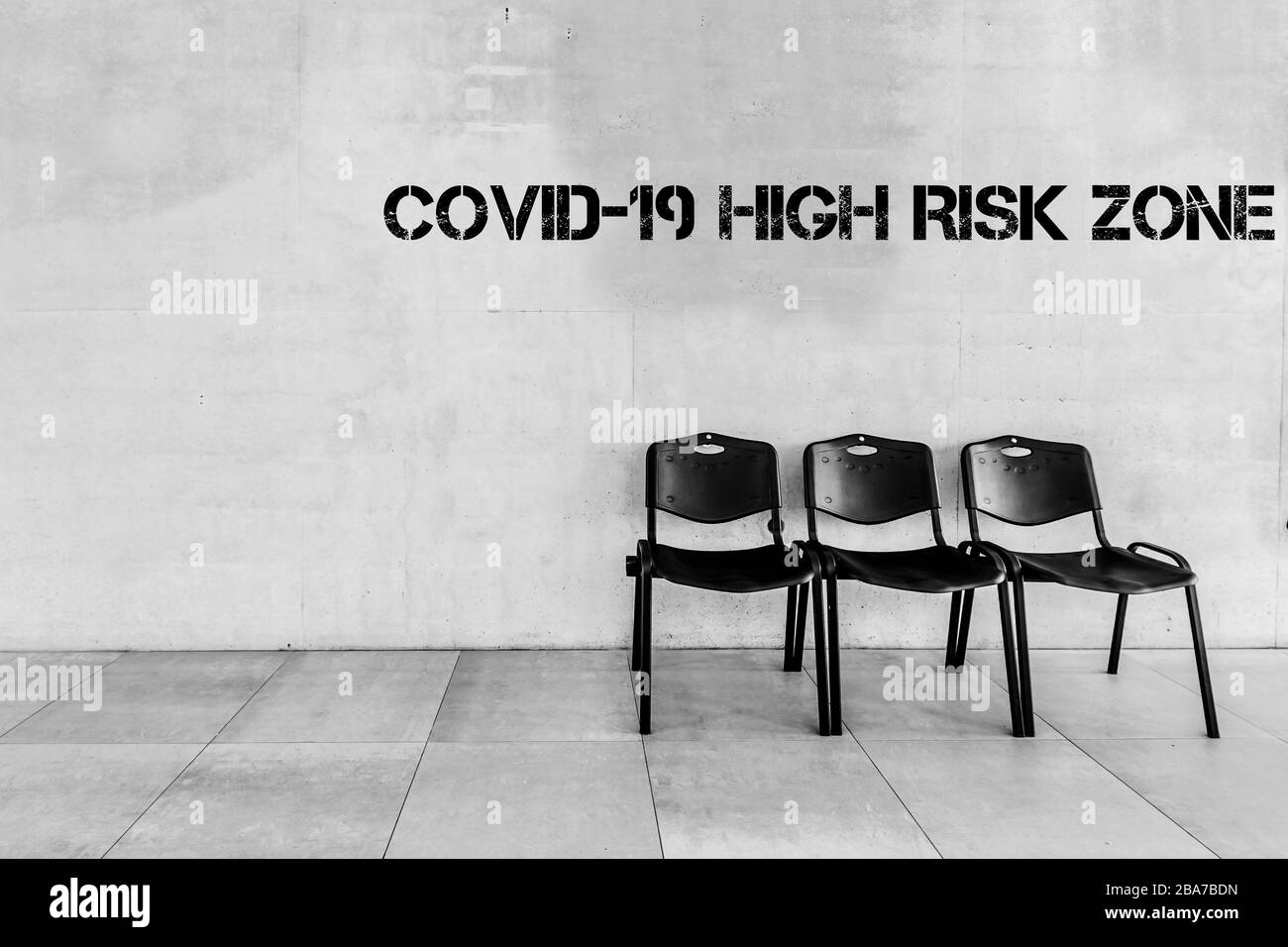 Three black chairs up against black white wall with the text saying ...