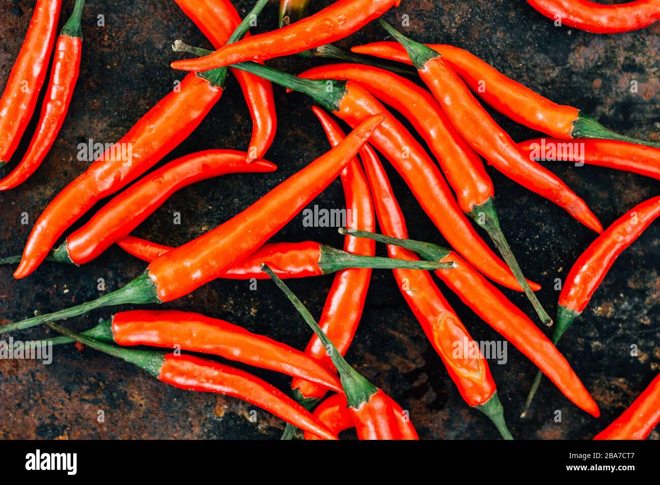 Red hot chili peppers over rustic surface - fresh and organic Stock ...