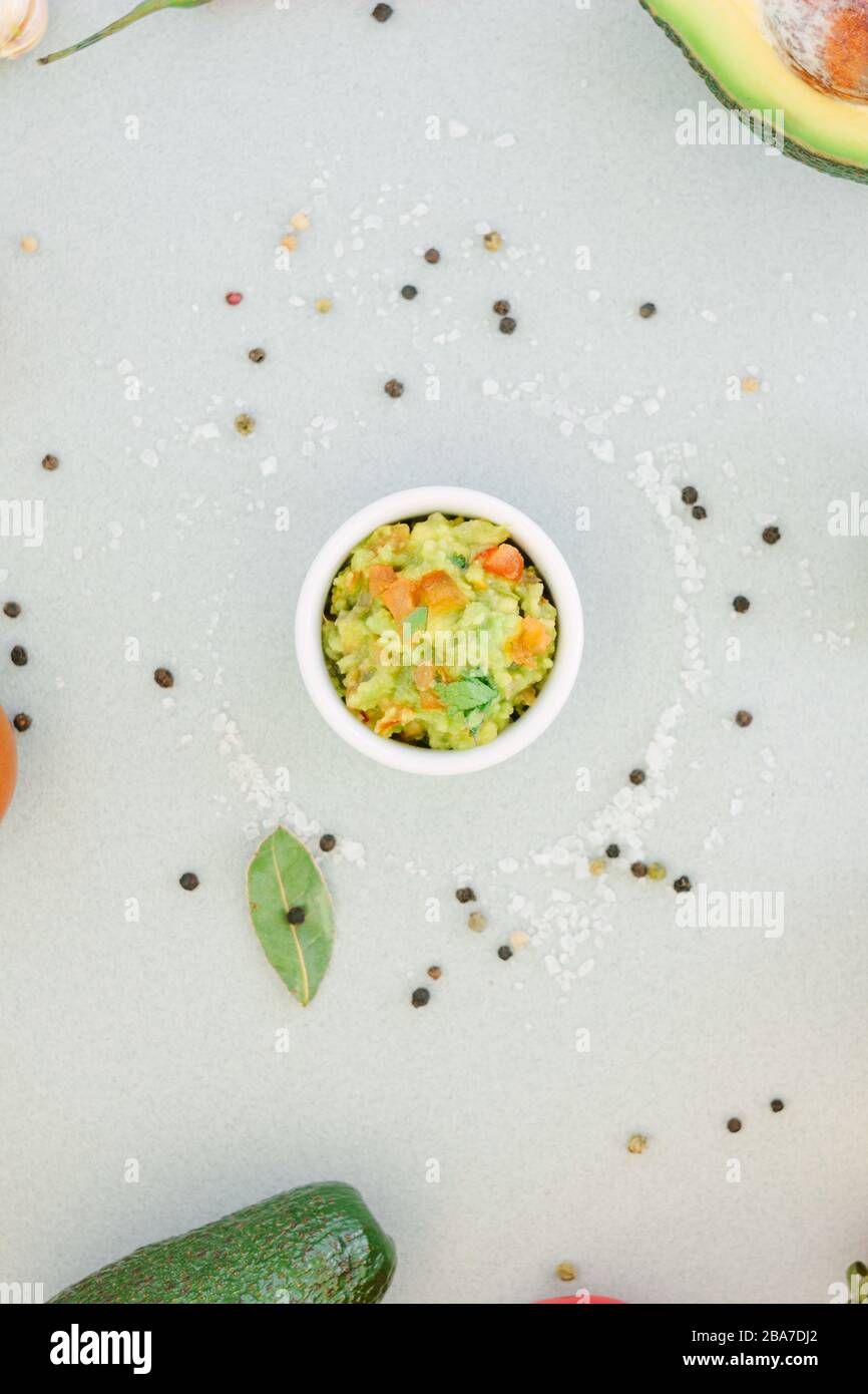 Traditional mexican avocado - vegetarian dip surrounded by its ...