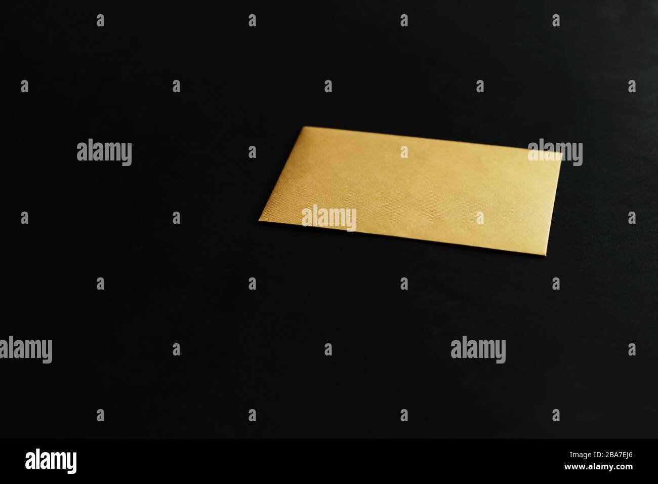 Blank golden paper card on black background, premium business and ...