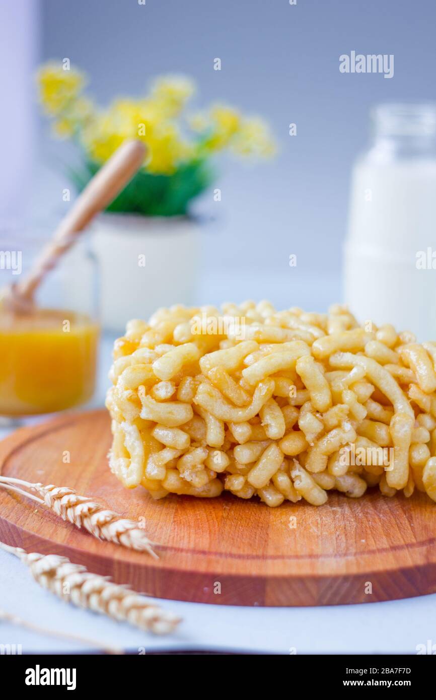 Sweet asian cake chak-chak with honey on wooden board Stock Photo - Alamy