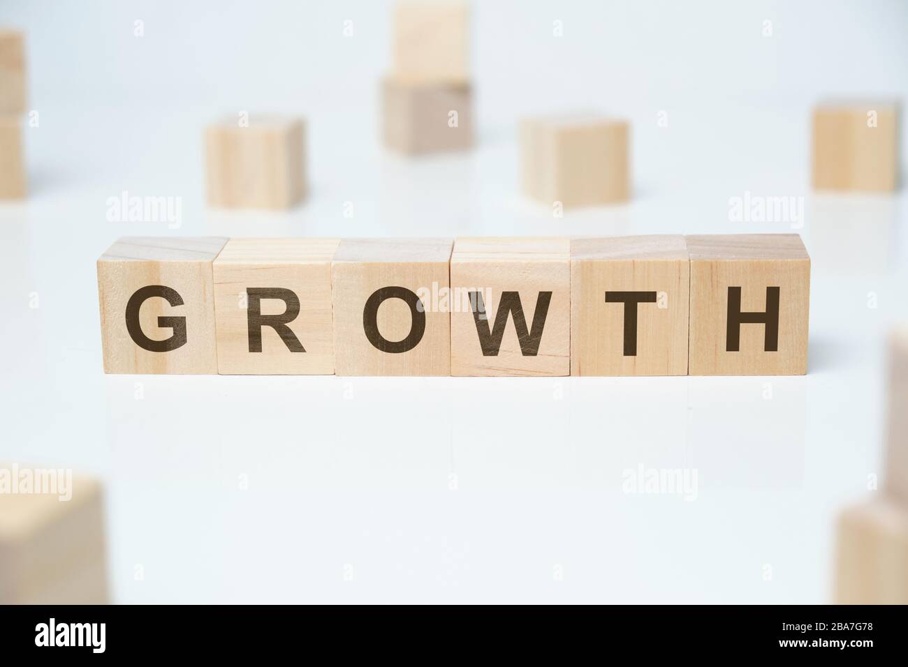 Wooden blocks on a white background with the inscription - growth ...