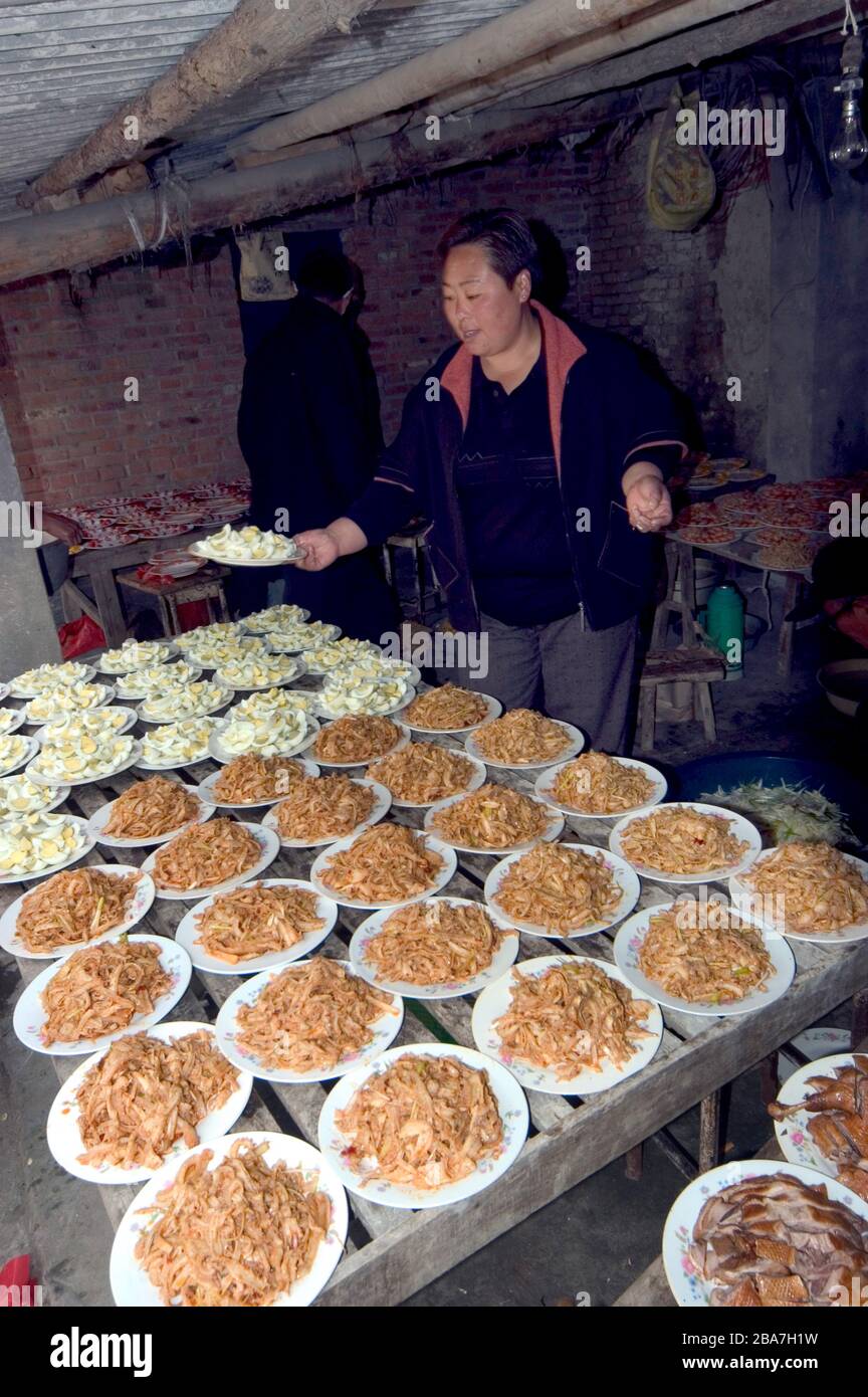 Chinese rural wedding banquet, a wide variety of dishes, many people ...
