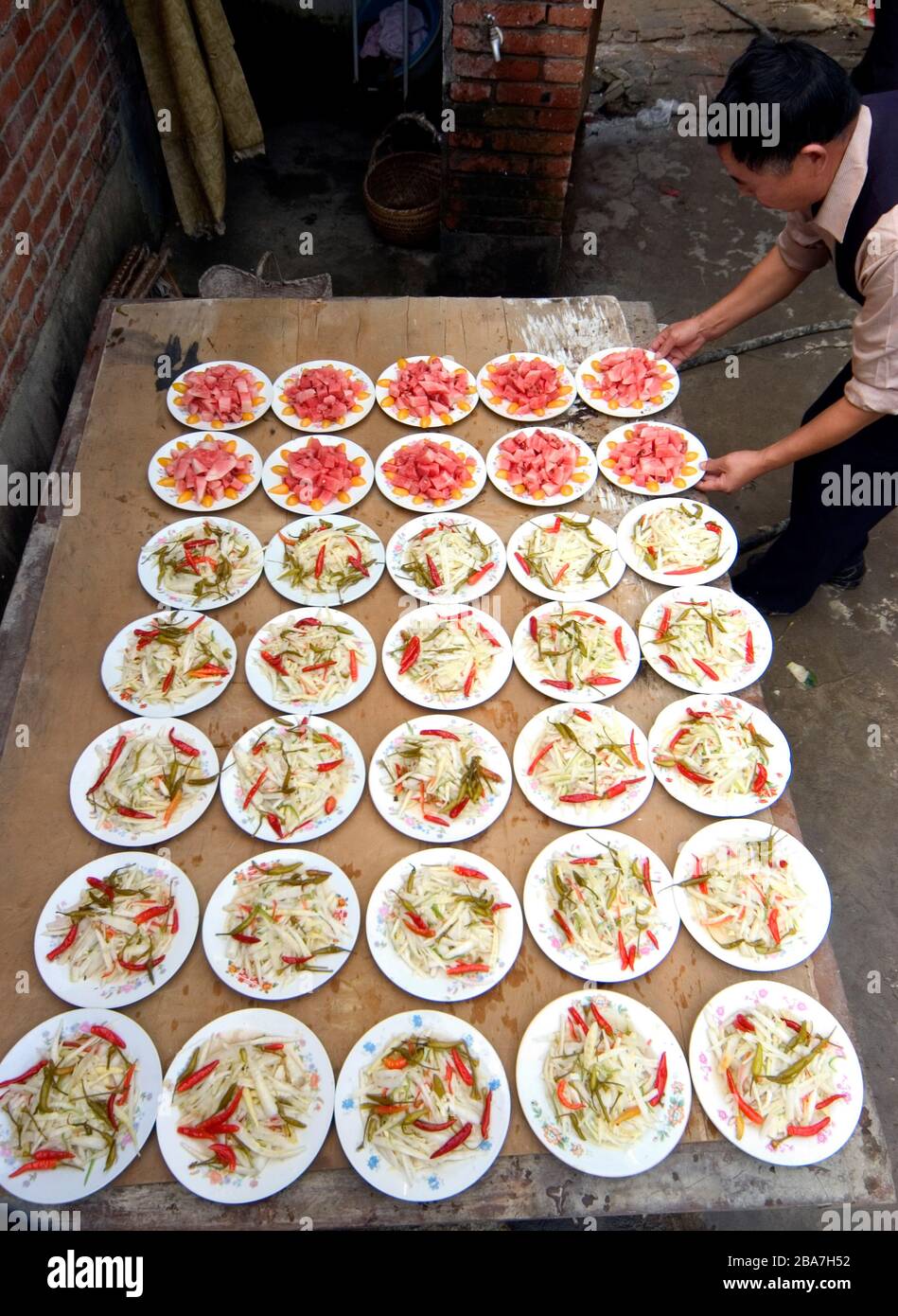 Chinese rural wedding banquet, a wide variety of dishes, many people ...