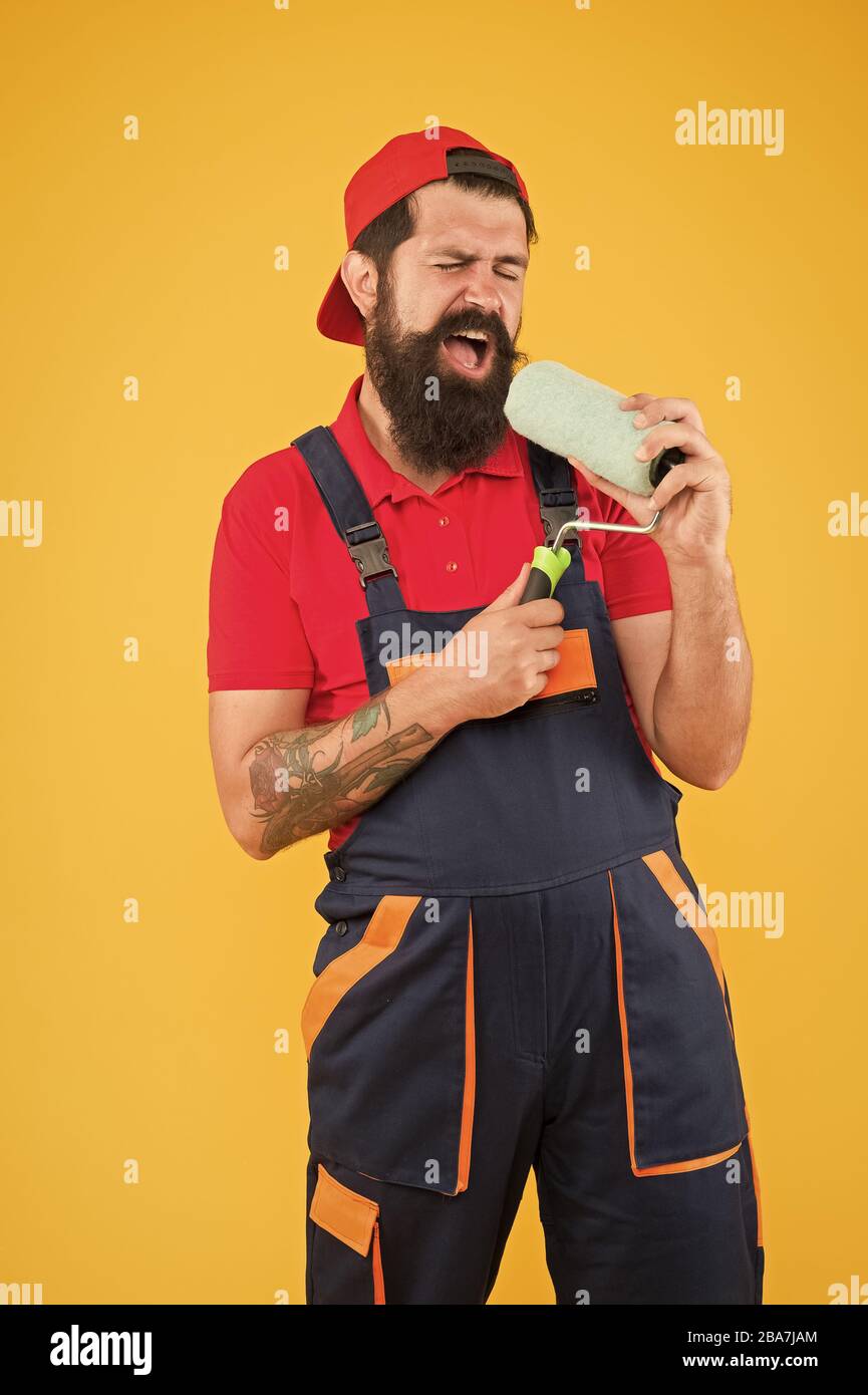 Industrial concept. creative repair concept. bearded man singing in ...