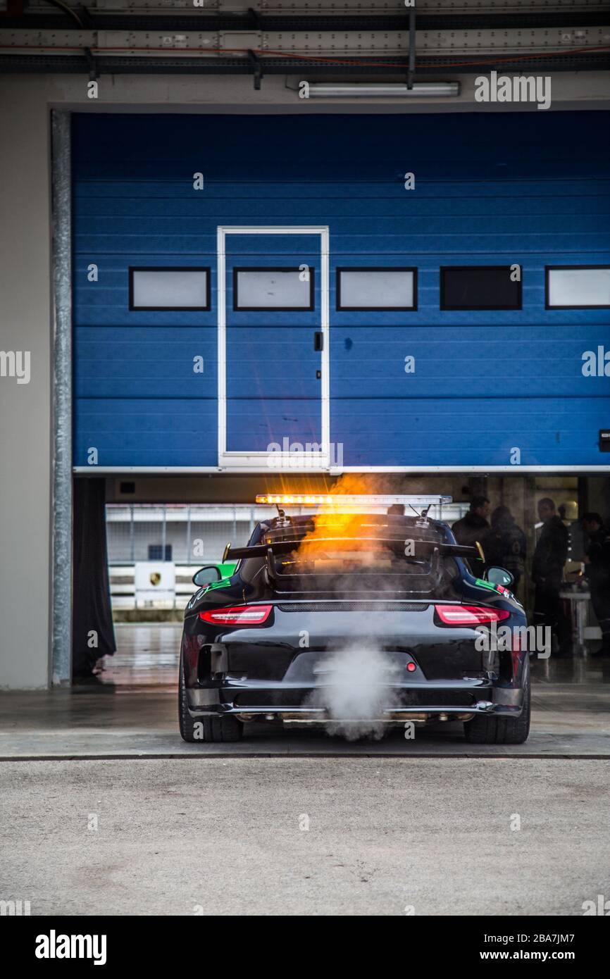 Silver sport car in the repair service Stock Photo - Alamy