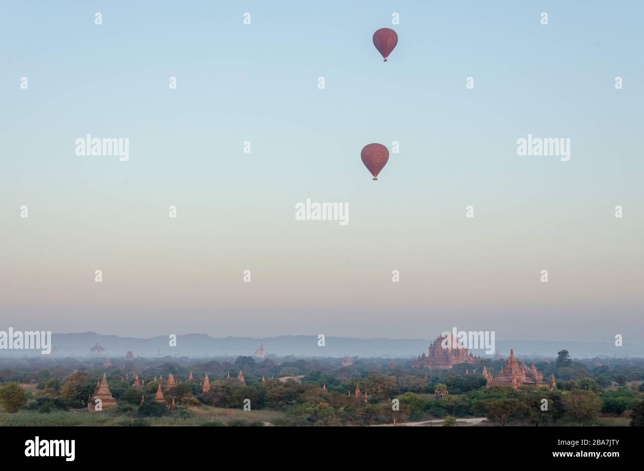At sunrise air balloons fly over temples in Bagan, Myanmar Stock Photo ...