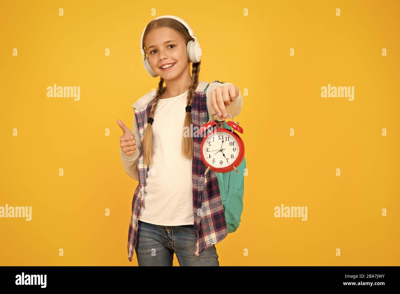 Beginning of lessons. Time go school. School time. Happy girl hold ...