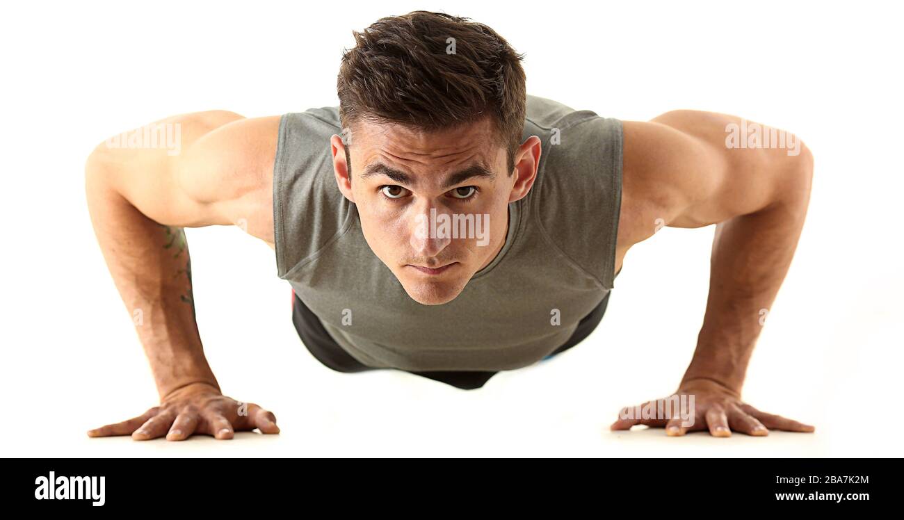 Fitness man wringing from the floor isoladed on white Stock Photo - Alamy