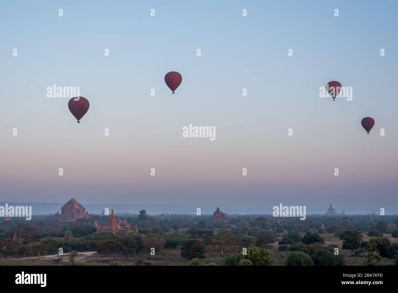 At sunrise air balloons fly over temples in Bagan, Myanmar Stock Photo ...
