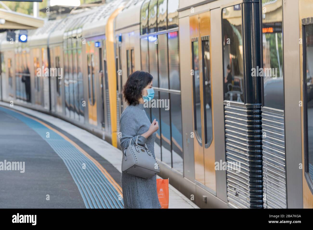 Masked people on trains hi-res stock photography and images - Alamy