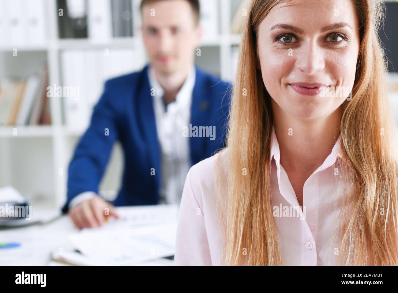 Beautiful smiling cheerful girl at workplace look in camera Stock Photo ...