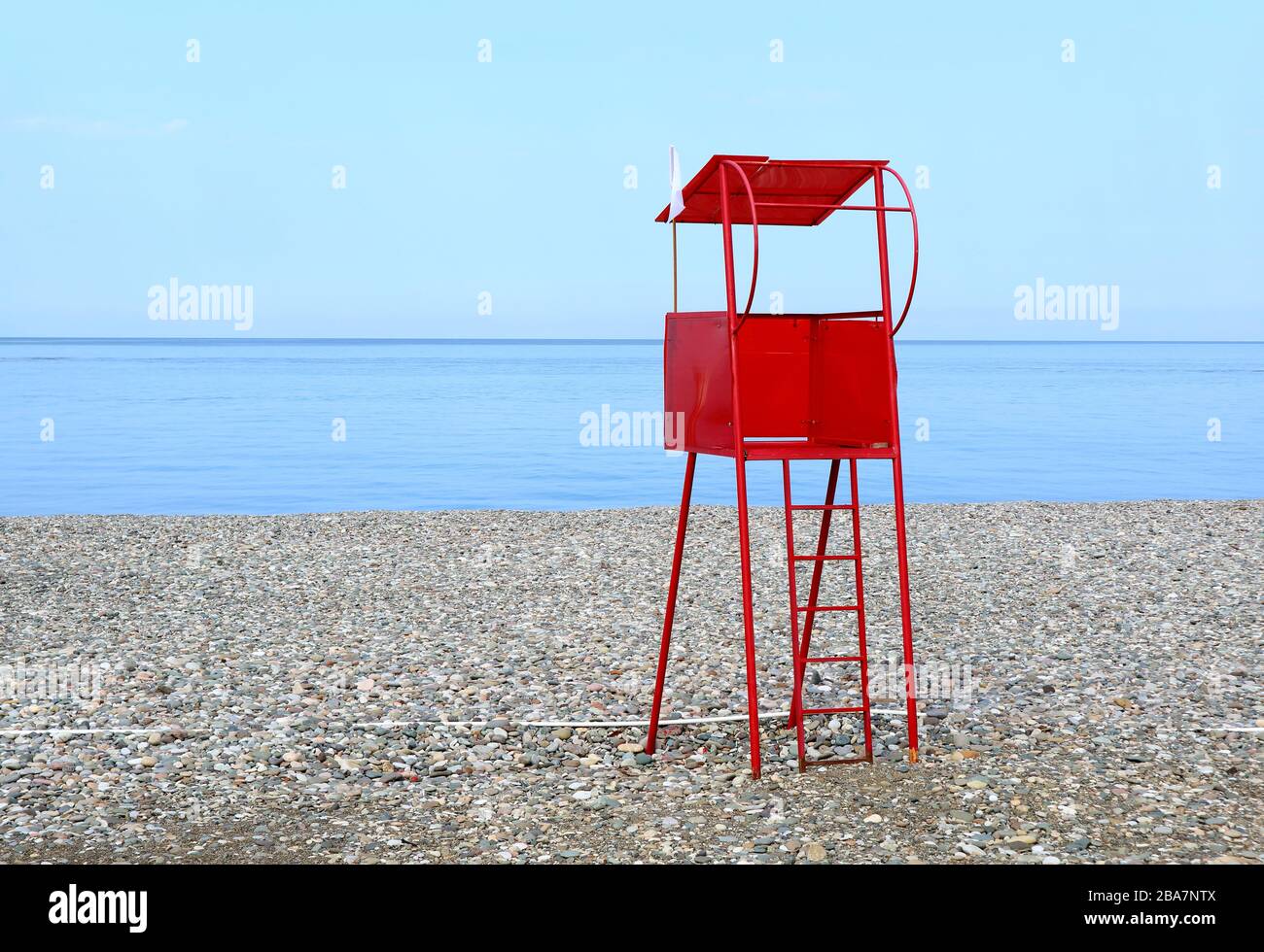Vibrant red lifeguard chair on the empty beach Stock Photo - Alamy