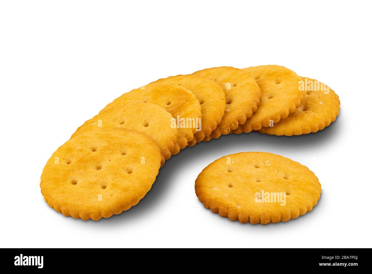 Crunchy round crackers lay on the floor on white background with ...