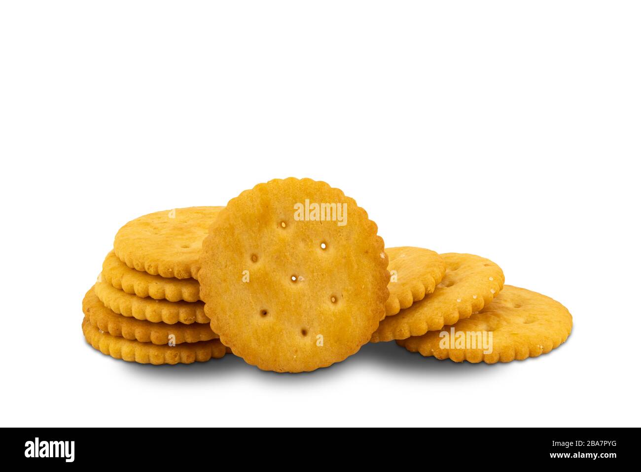 Pile of freshly baked crunchy round crackers on white background with ...