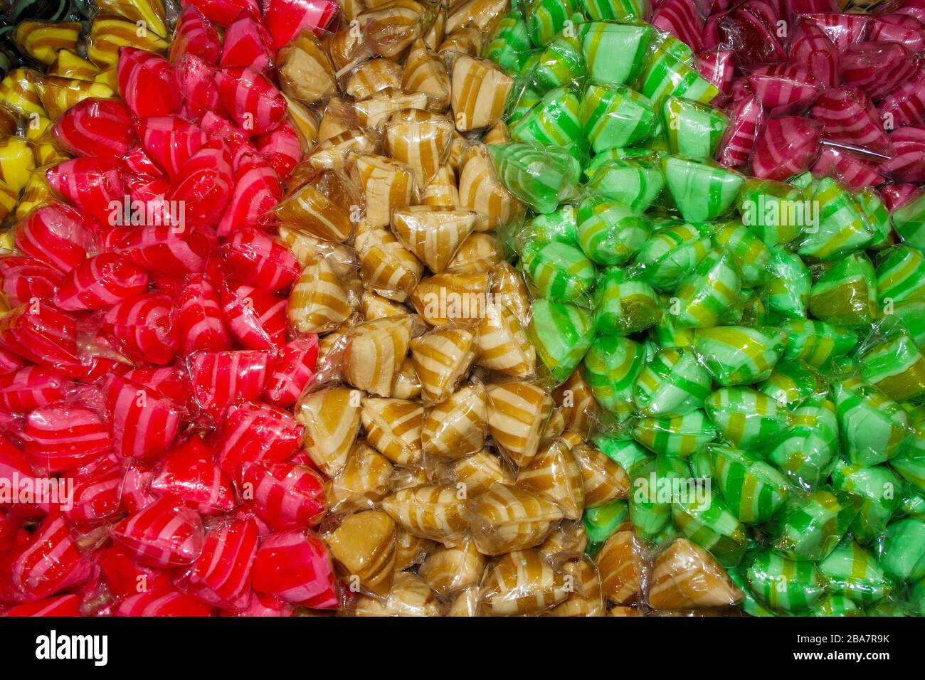 Colourful sweets arranged by colour Stock Photo - Alamy