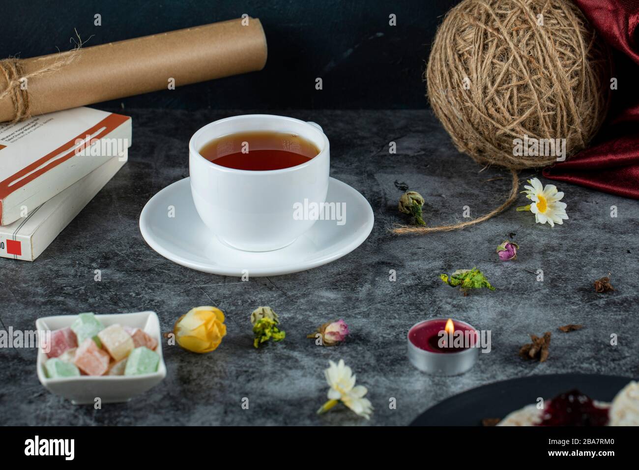 A cup of tea with sweets and snacks Stock Photo - Alamy