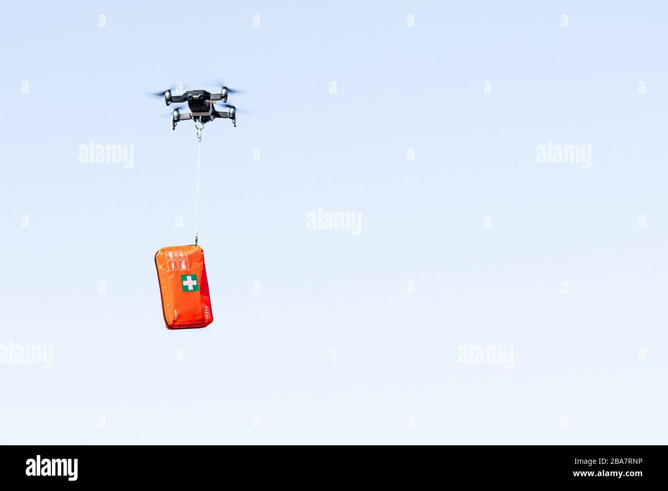 drone delivers a first aid kit with coronavirus medication, concept for ...
