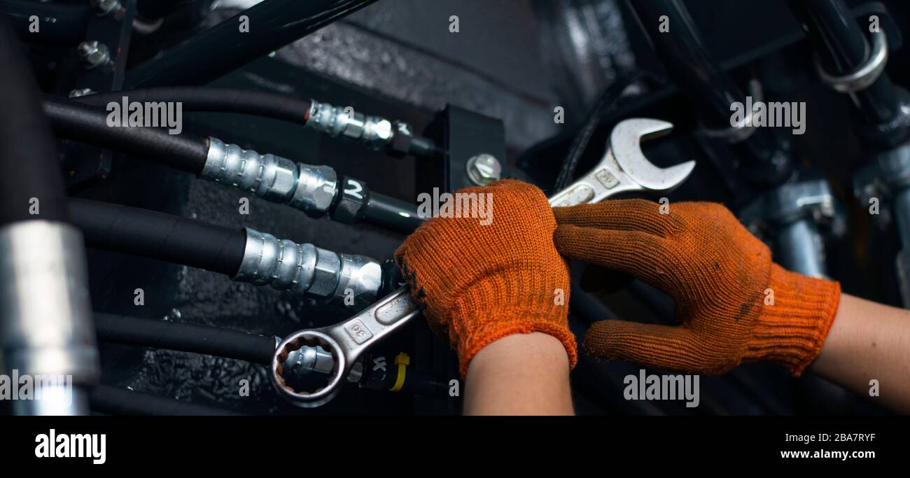 Banner with close up view of hydraulic pipes of heavy industry machine ...