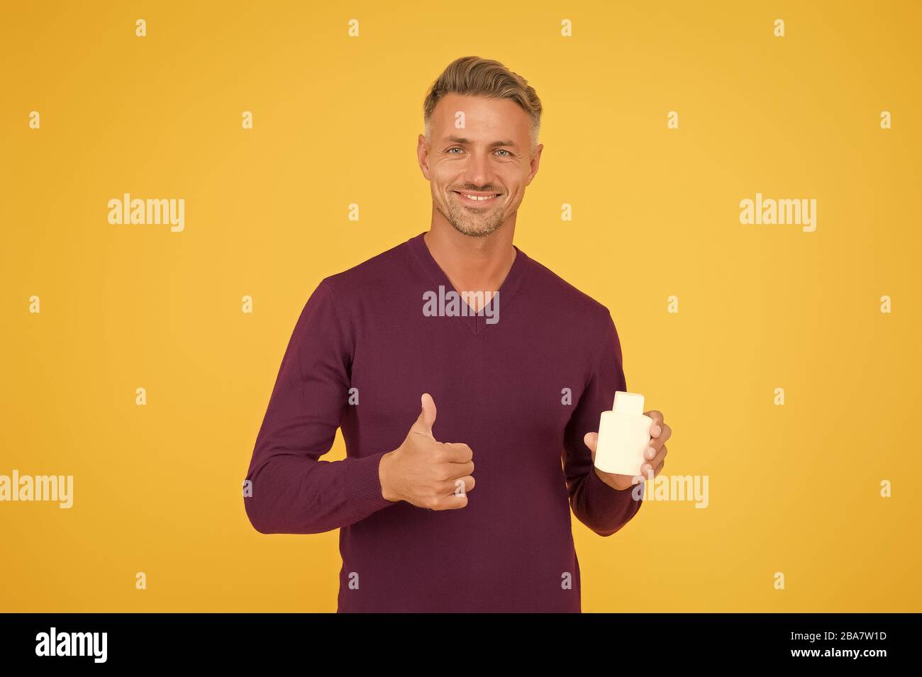 Product for sale. Happy guy give thumbs up to product. Handsome man ...