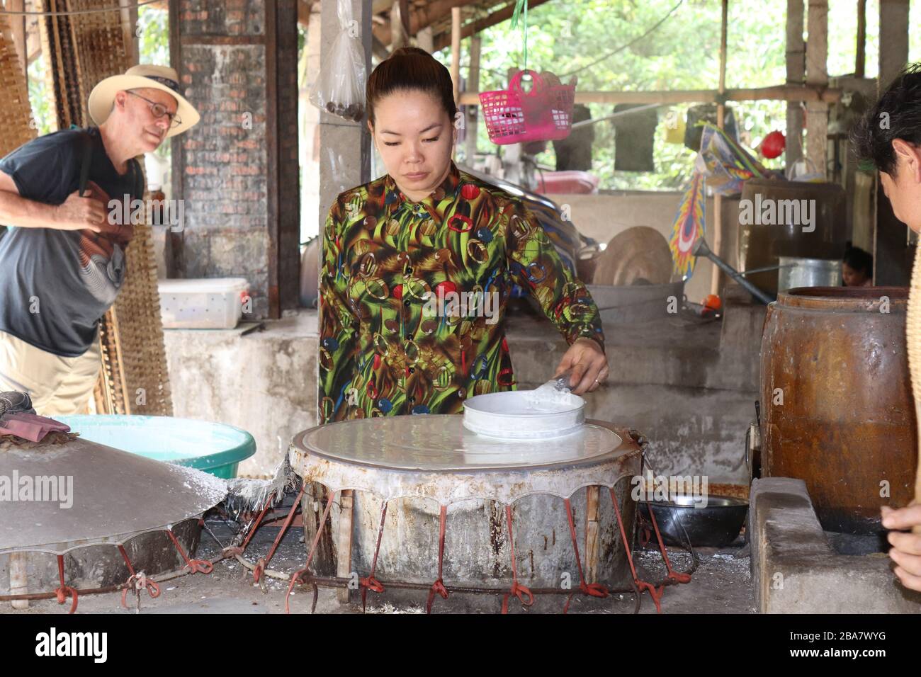 VILLAGERS MAKING RICE PAPER IN THE MEKONG DELTA,VIETNAM Stock Photo - Alamy