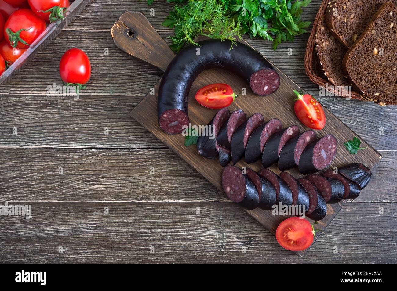 Morsilla - blood sausage. Pieces of Spanish black pudding on a wooden ...