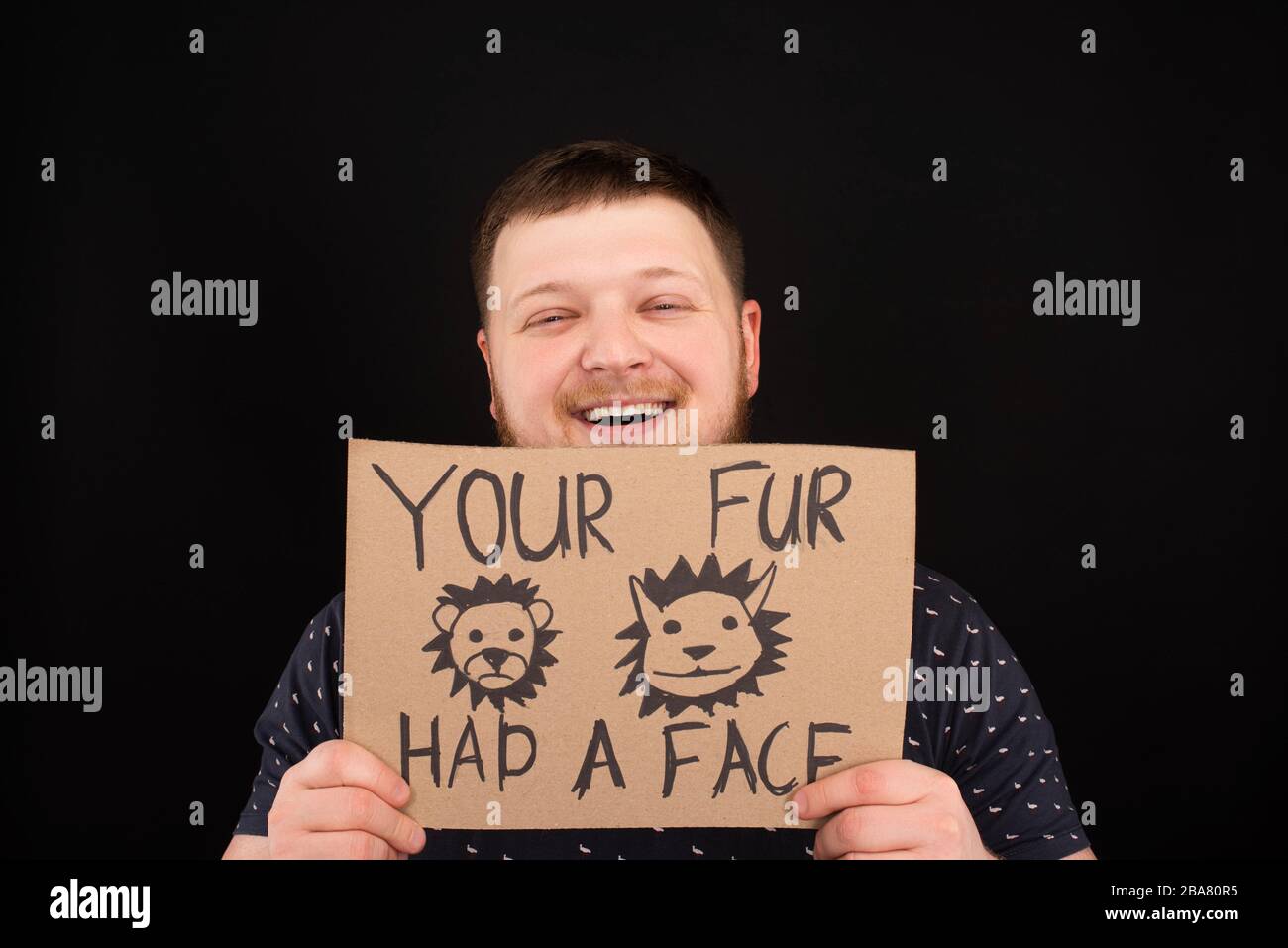 happy smiling man holding cardboard sign with your fur had a face ...