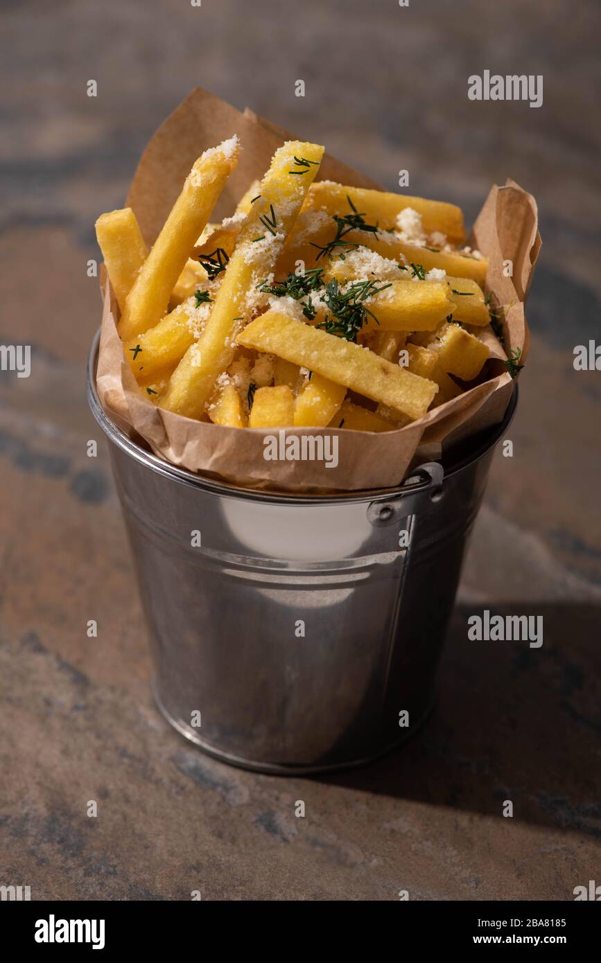 bucket of tasty french fries on marble surface Stock Photo - Alamy