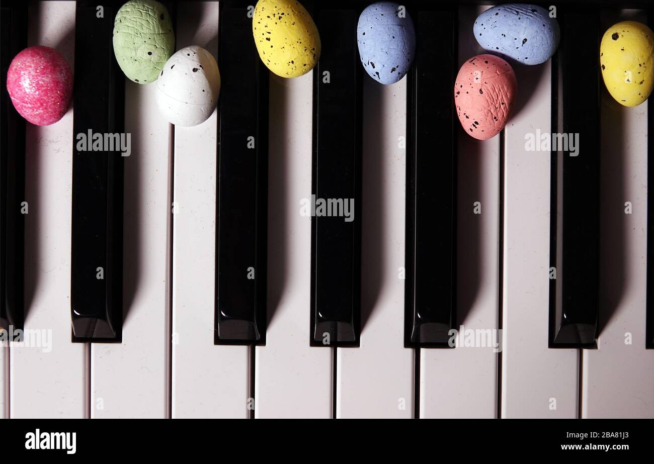 Colorful Paschal Easter Eggs and Piano Keys Stock Photo - Alamy
