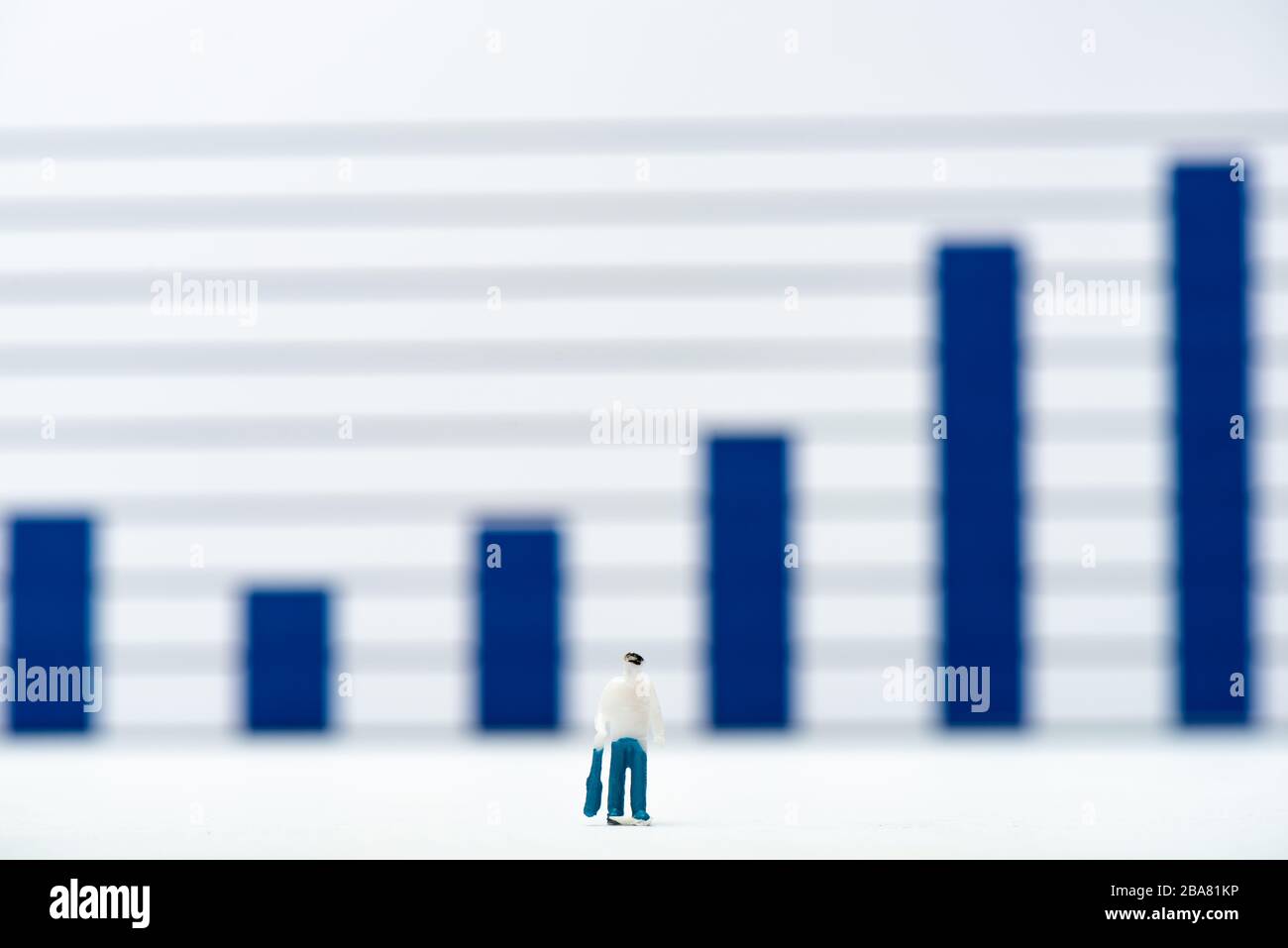 Selective focus of people figure on white surface with infographics at ...