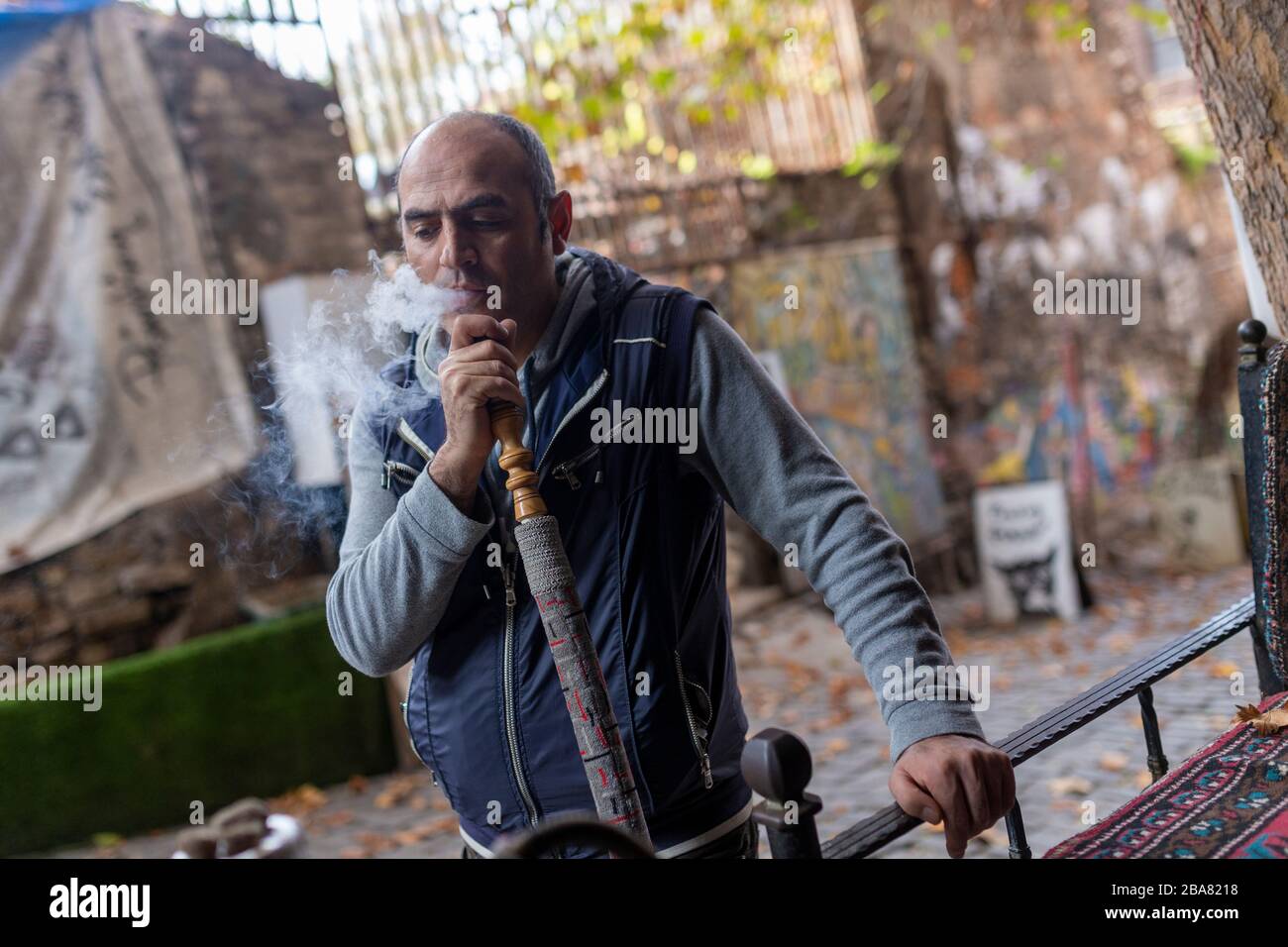 Smoking traditional nargile (hookah) in the streets of Istanbul Stock ...