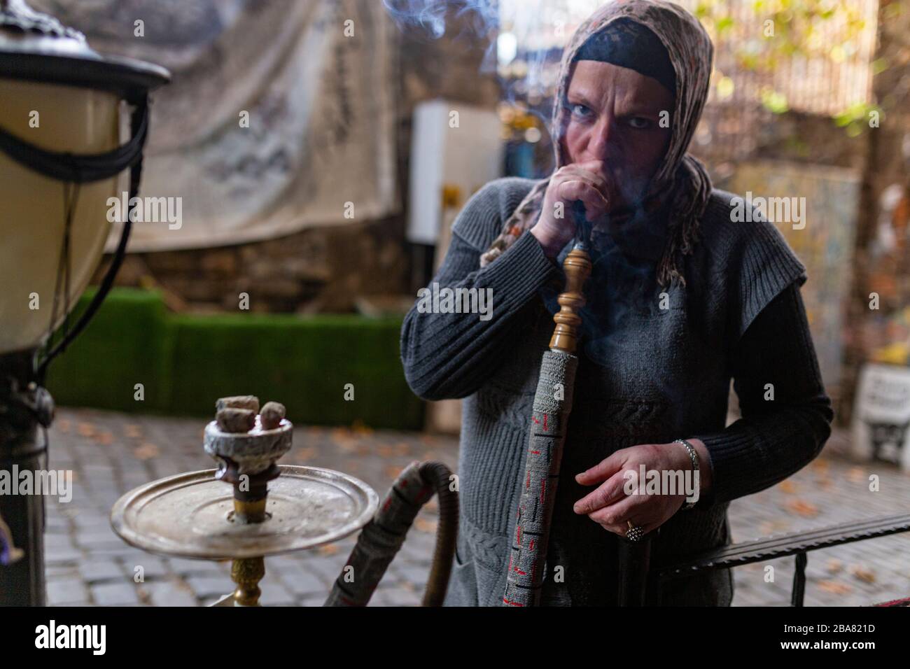 Smoking traditional nargile (hookah) in the streets of Istanbul Stock ...
