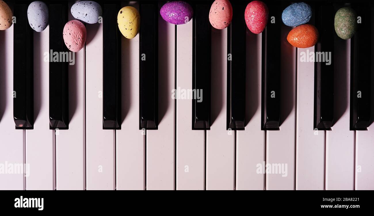 Colorful Paschal Easter Eggs and Piano Keys Stock Photo - Alamy