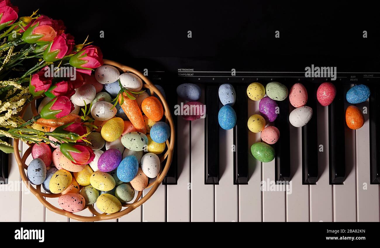 Colorful Paschal Easter Eggs and Piano Keys Stock Photo - Alamy