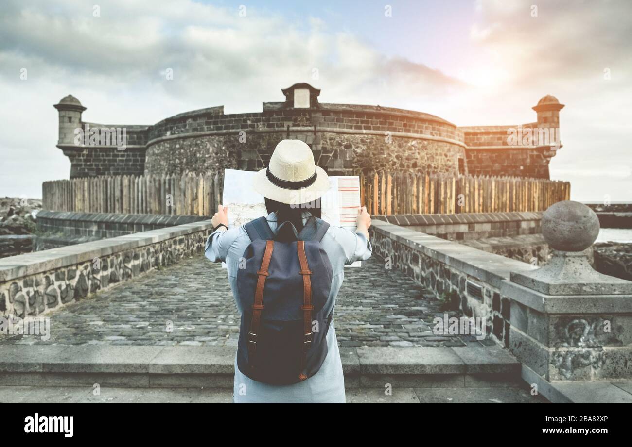 Young woman tourist looking map during city tour - Travel girl going ...