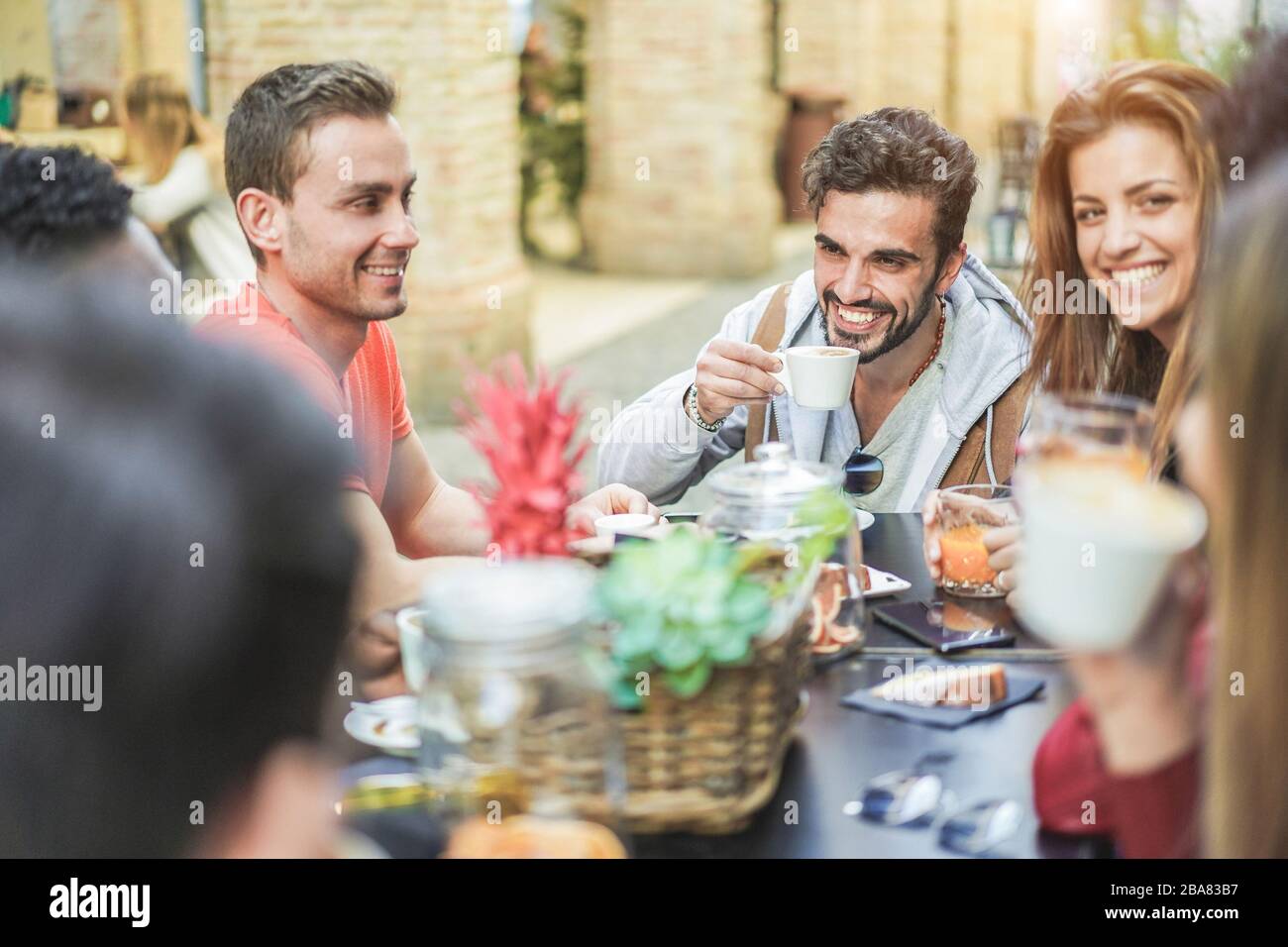 Group of happy friends drinking coffee and cappuccino at vintage bar ...